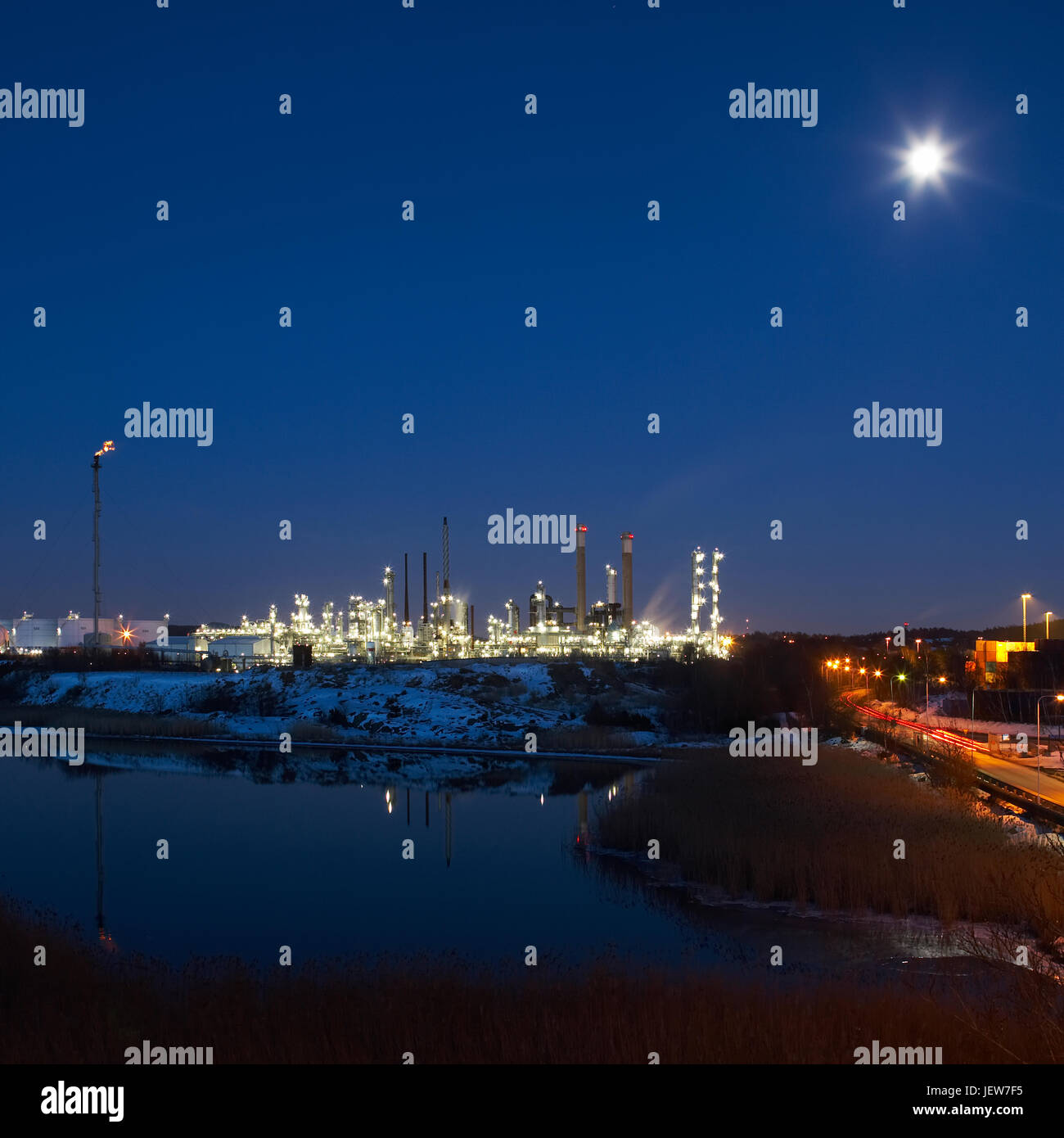 Illuminated factory at night Stock Photo - Alamy