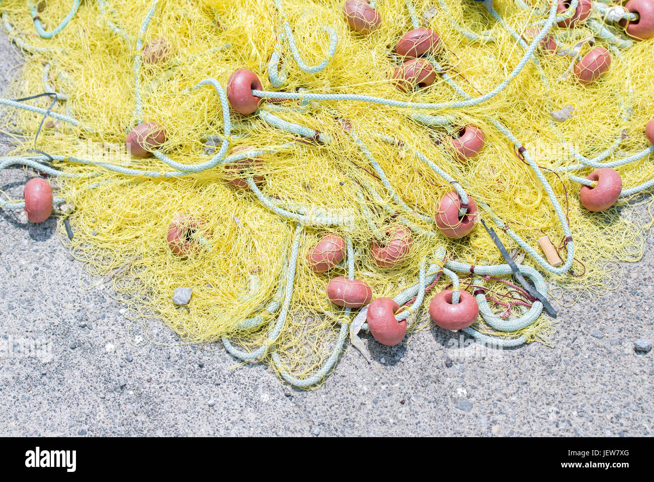 Yellow fishing net on the quay Stock Photo - Alamy