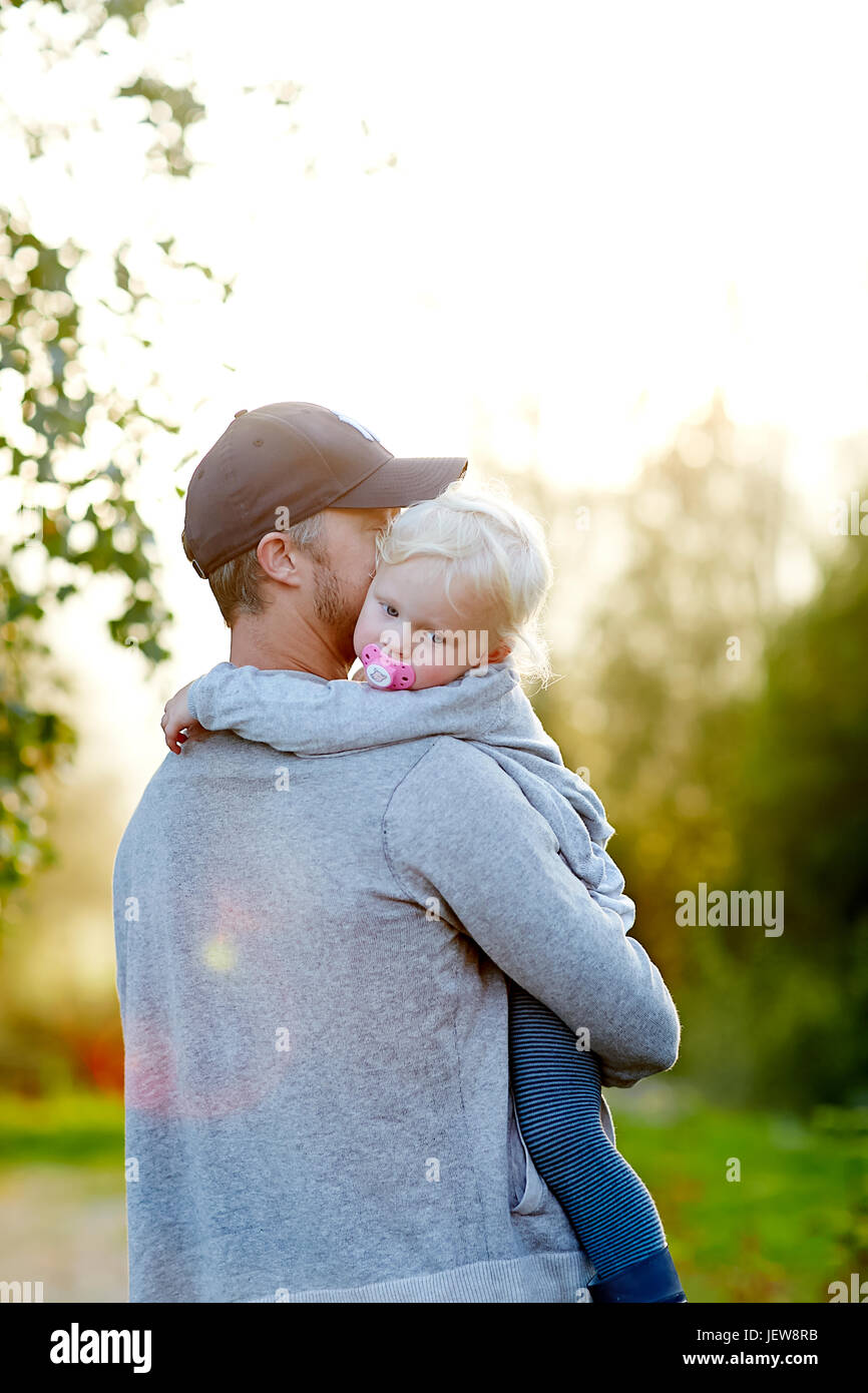 Girl hugging father Stock Photo - Alamy