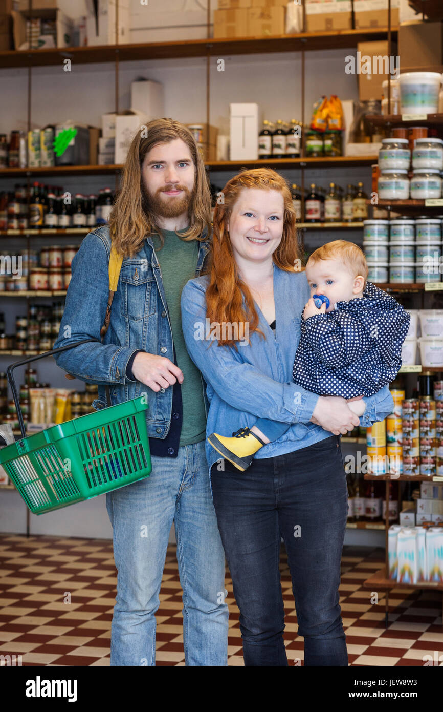 Family in shop Stock Photo - Alamy