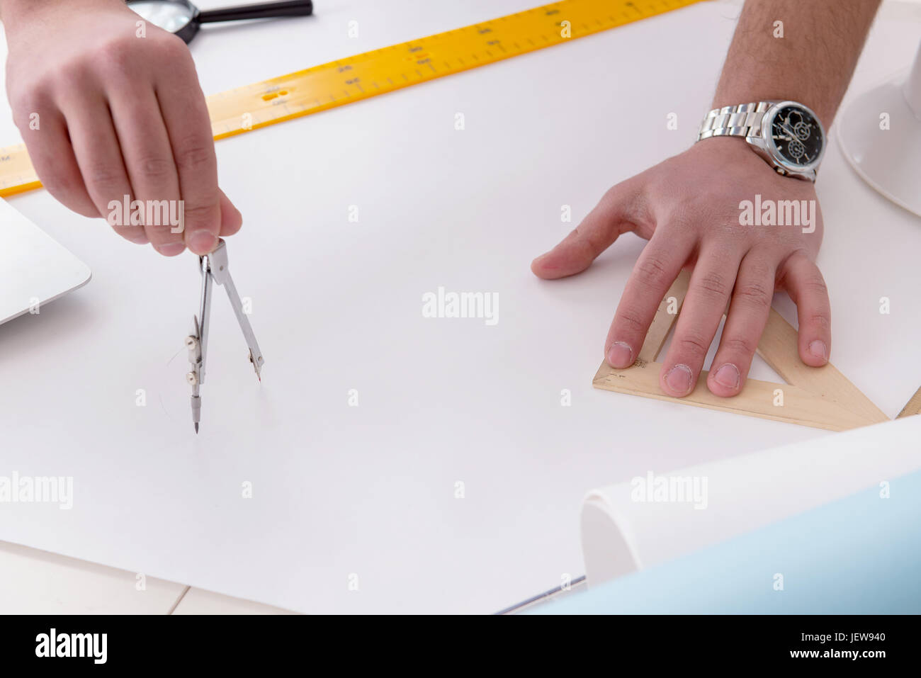 Male engineer working on drawings and blueprints Stock Photo - Alamy