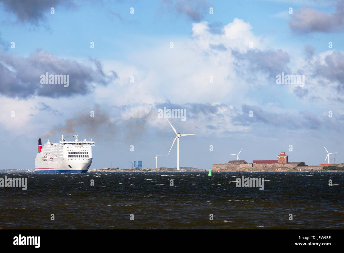 Ferry on sea, wind turbines on background Stock Photo - Alamy