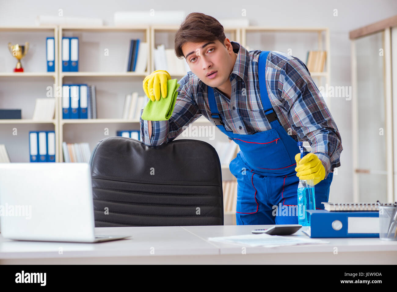 Male cleaner working in the office Stock Photo - Alamy