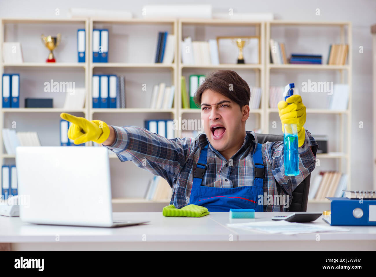 Male cleaner working in the office Stock Photo - Alamy