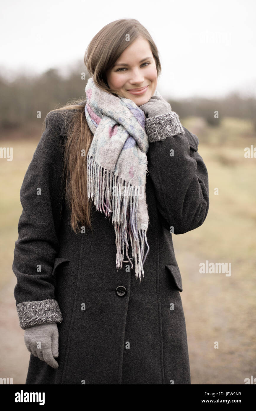 Smiling woman looking at camera Stock Photo - Alamy