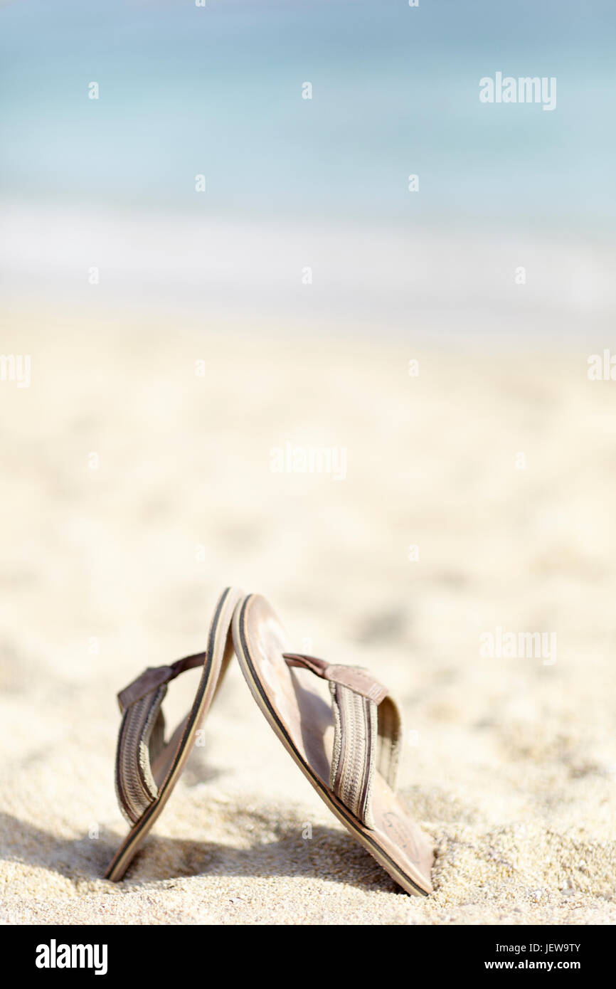 Flip flops on beach Stock Photo - Alamy