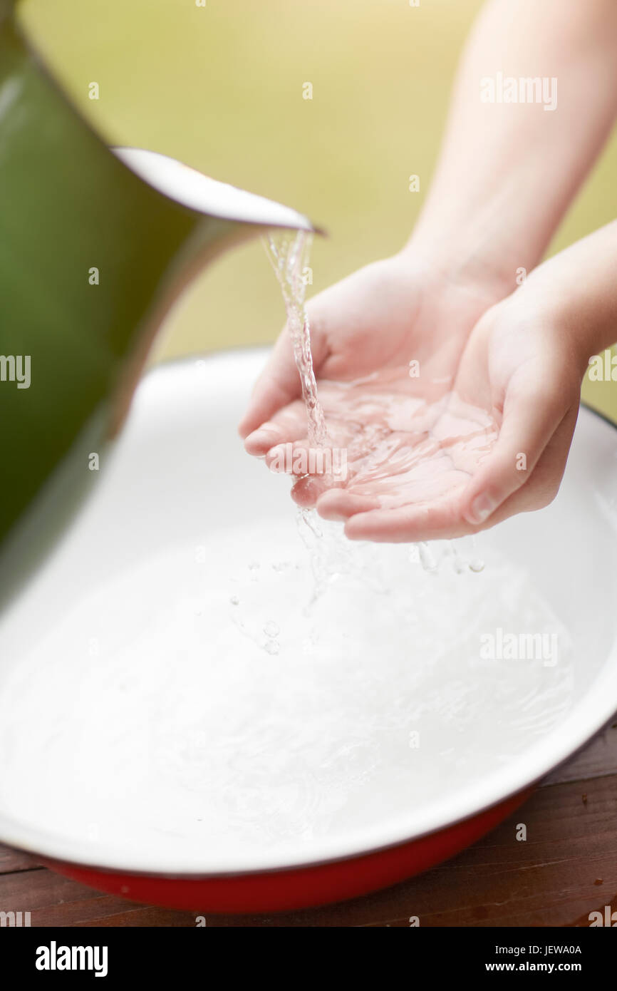 Water pouring onto hands Stock Photo - Alamy