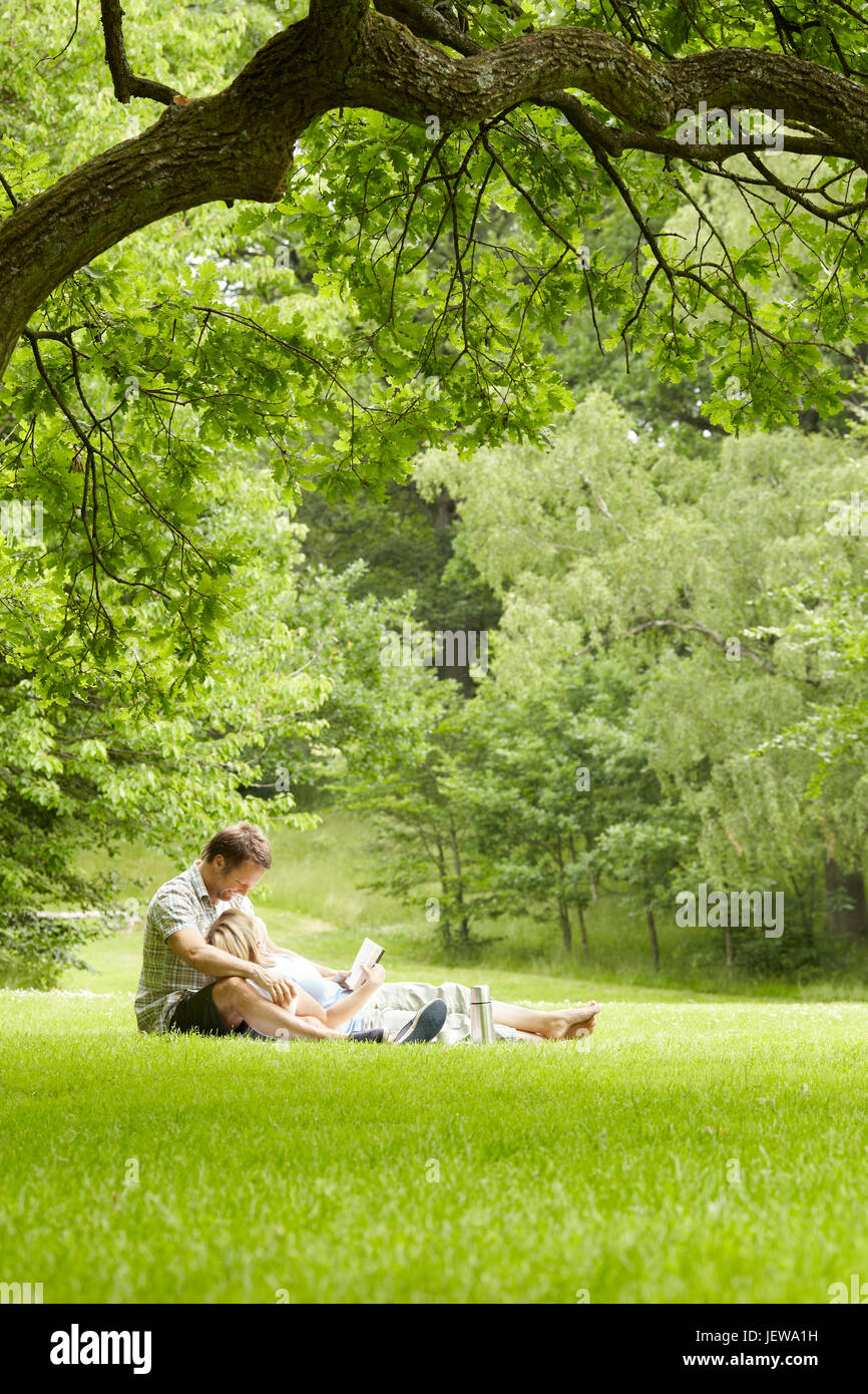 Couple in park Stock Photo - Alamy