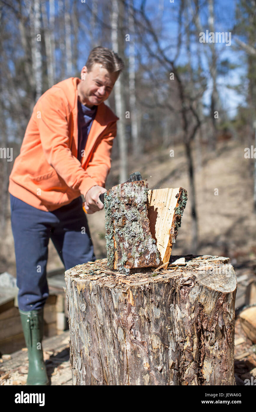 Man chopping wood Stock Photo - Alamy