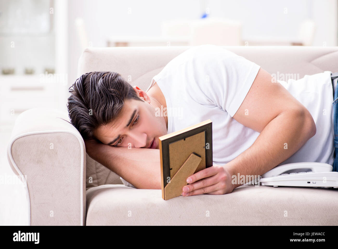 Young man in sad saint valentine concept Stock Photo - Alamy