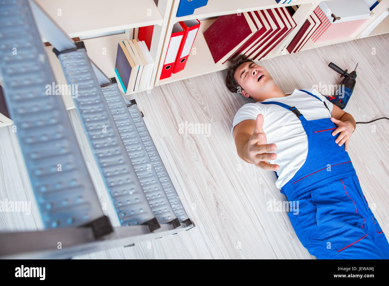 Unsafe behavior concept with falling worker Stock Photo - Alamy
