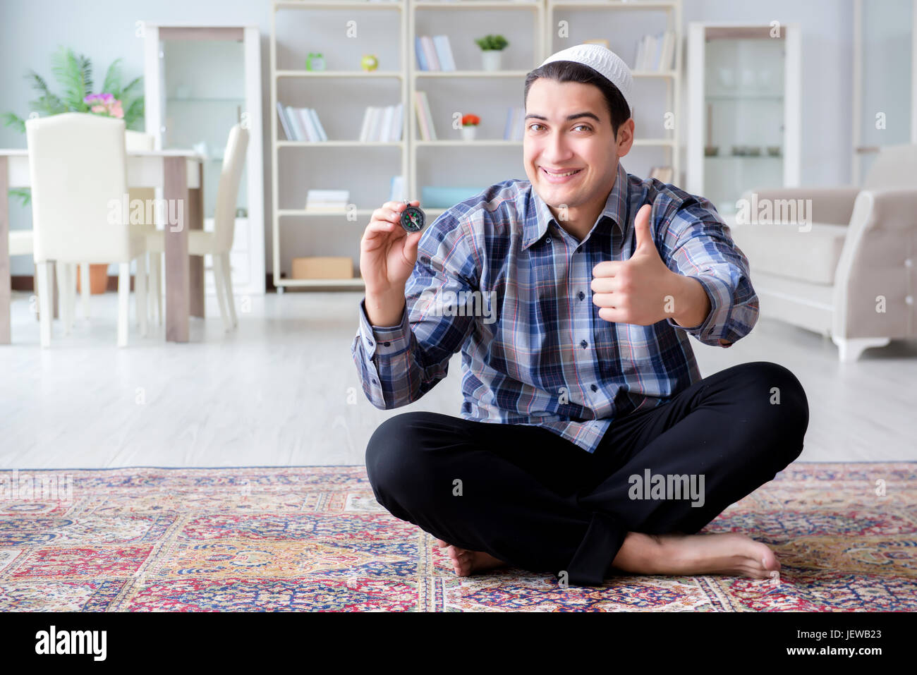 Muslim man praying at home Stock Photo - Alamy