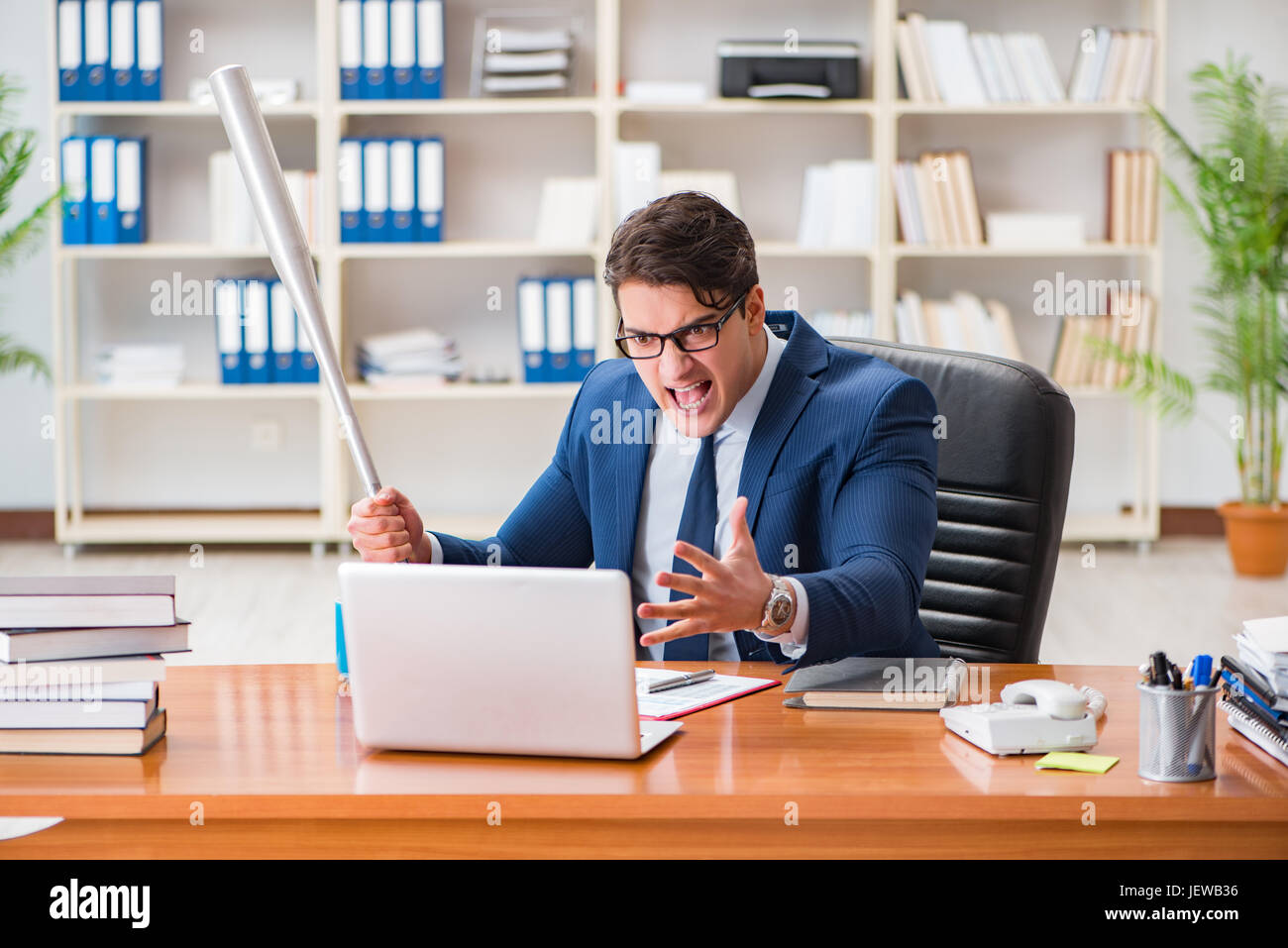 Angry aggressive businessman in the office Stock Photo - Alamy