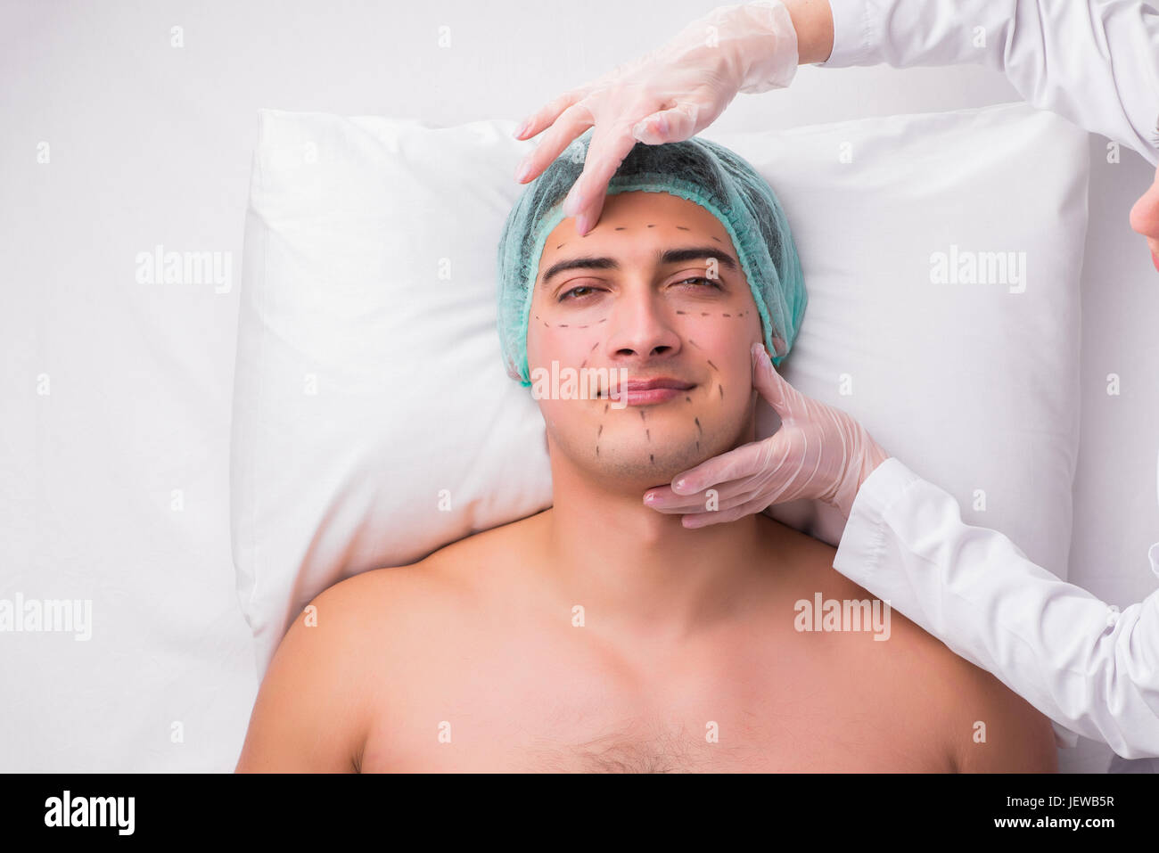 Handsome man in spa massage concept Stock Photo - Alamy