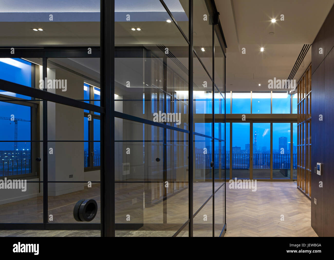 Interior corridor view towards dusk. Penthouse at the Tapestry Building ...