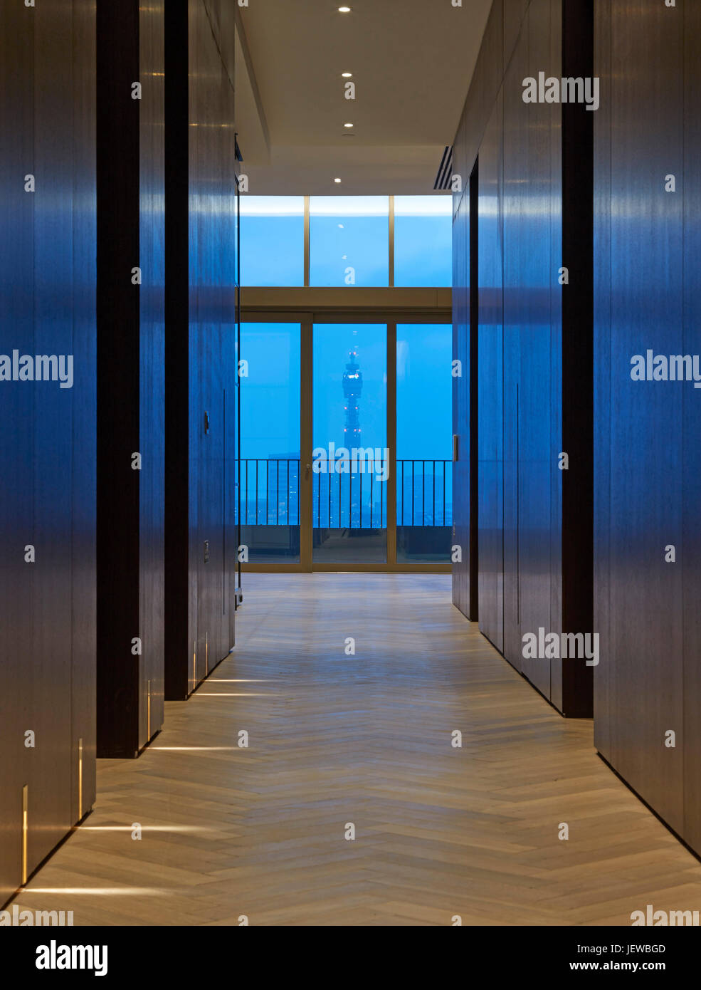 Interior corridor view towards dusk. Penthouse at the Tapestry Building ...