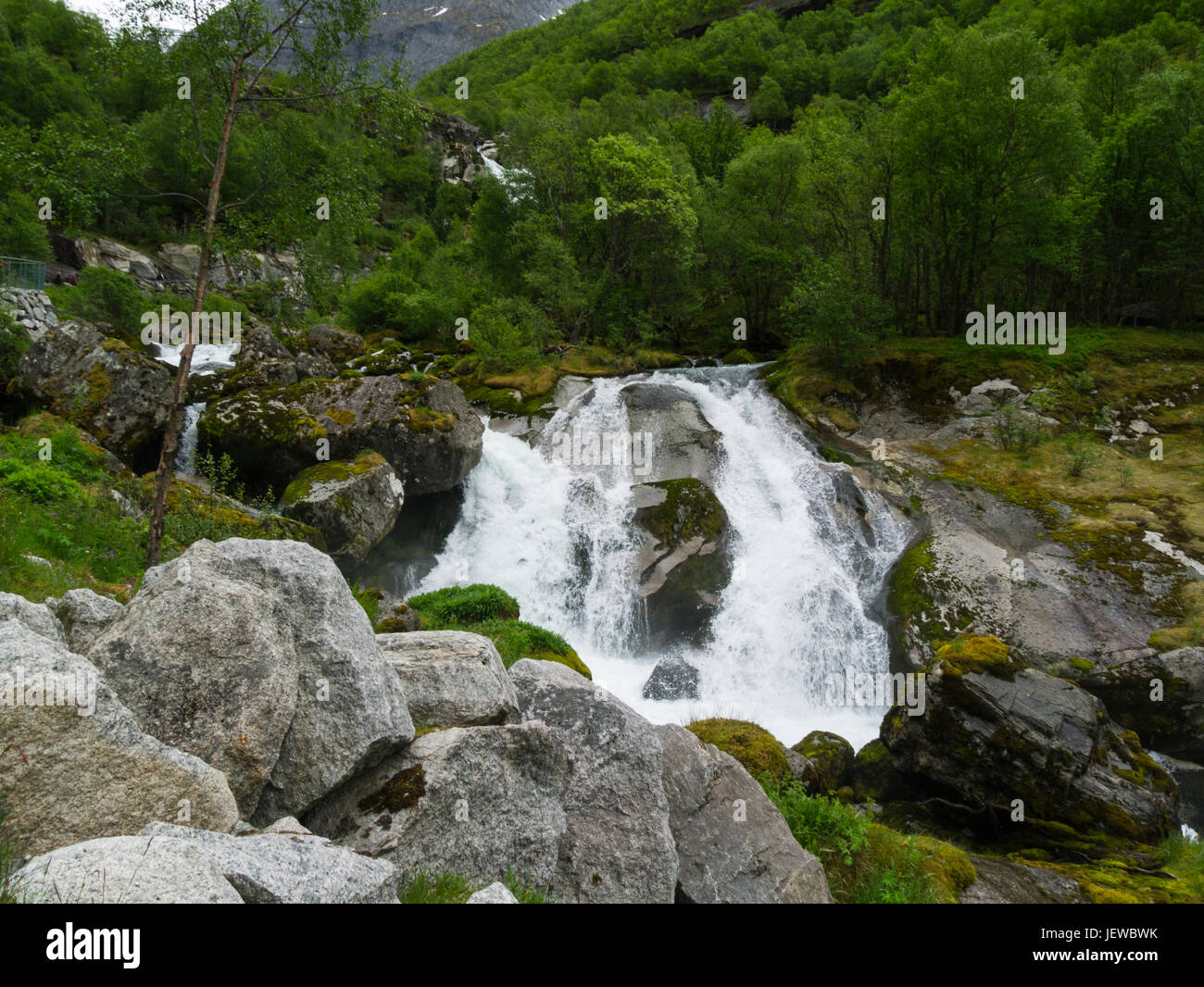 Kleivafossen waterfall fed with meltwater from Briksdal glacier ...
