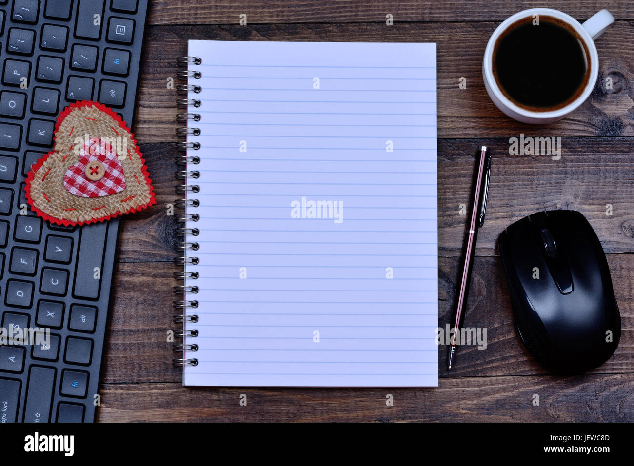 Notepad with keyboard computer and coffee cup on desk Stock Photo - Alamy