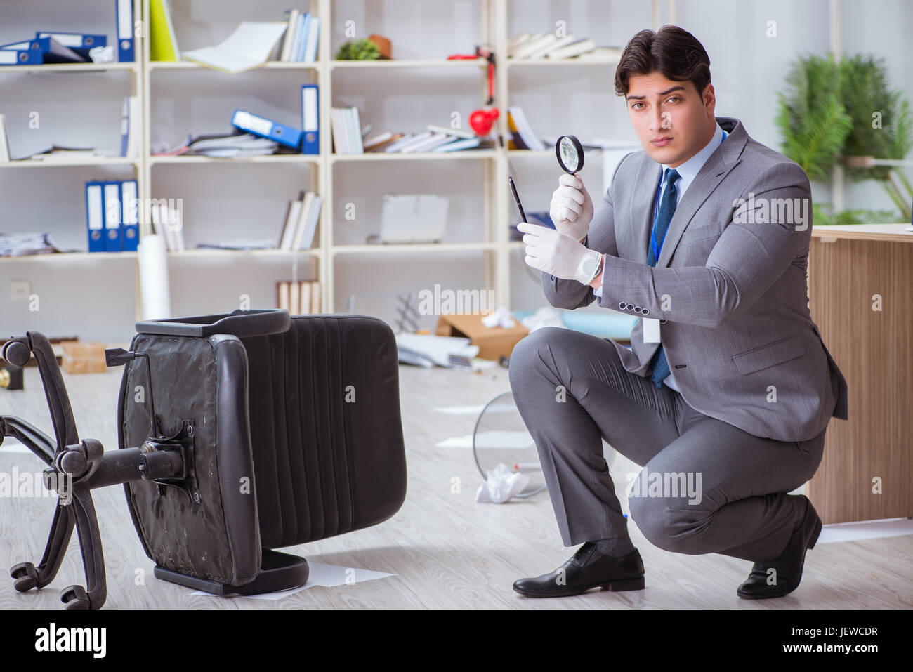 Young man during crime investigation in office Stock Photo - Alamy