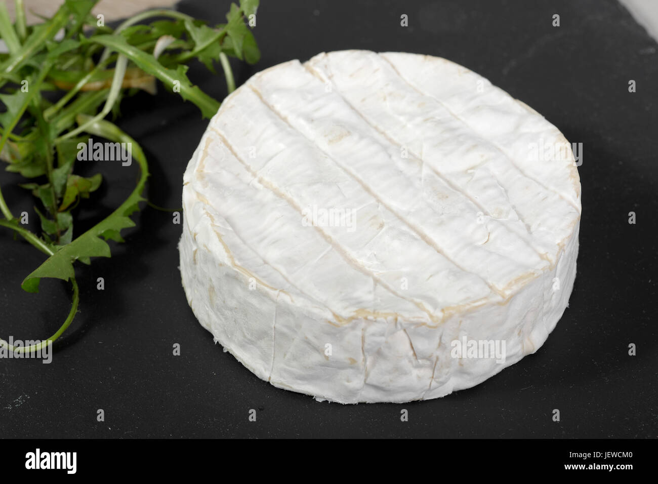 a camembert of Normandy on a slate Stock Photo - Alamy