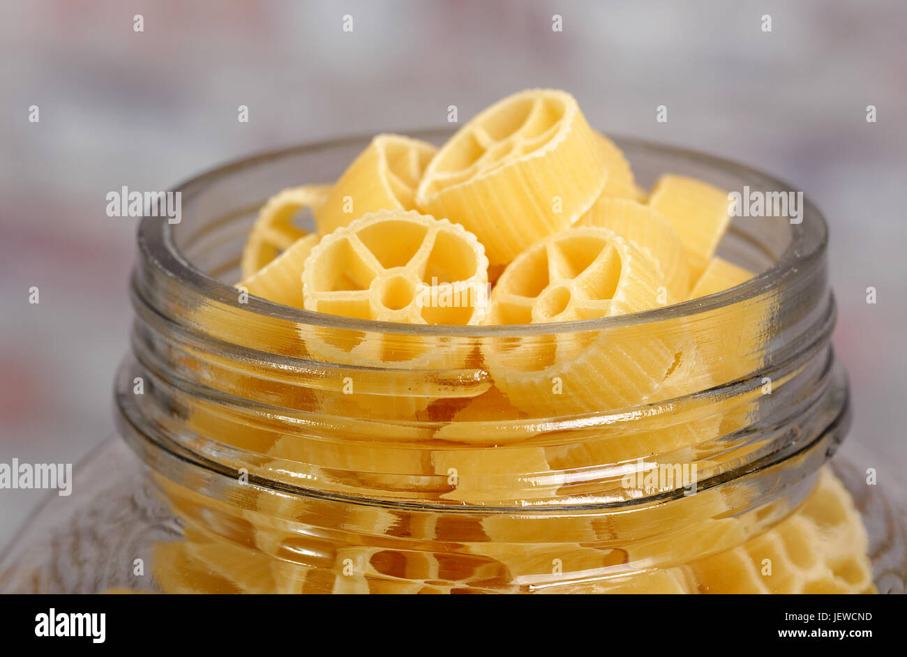 close up of container filled with raw pasta Stock Photo - Alamy