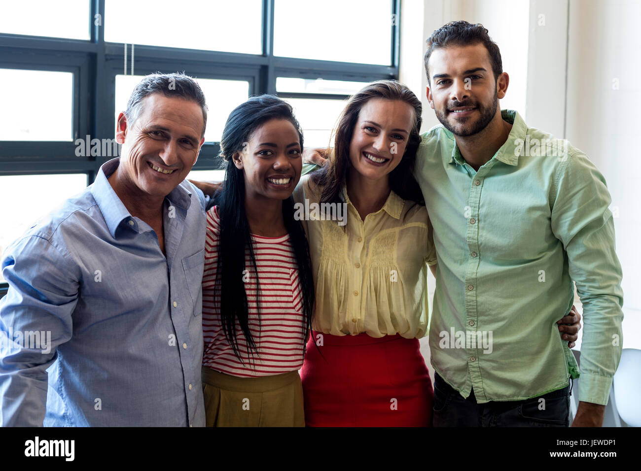 Team of colleagues posing together Stock Photo - Alamy