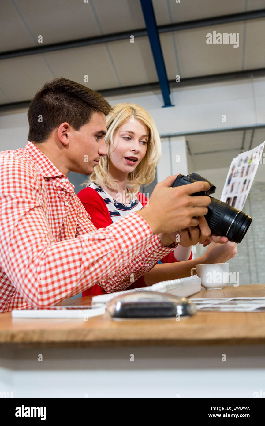 Colleagues checking a photos in camera Stock Photo - Alamy