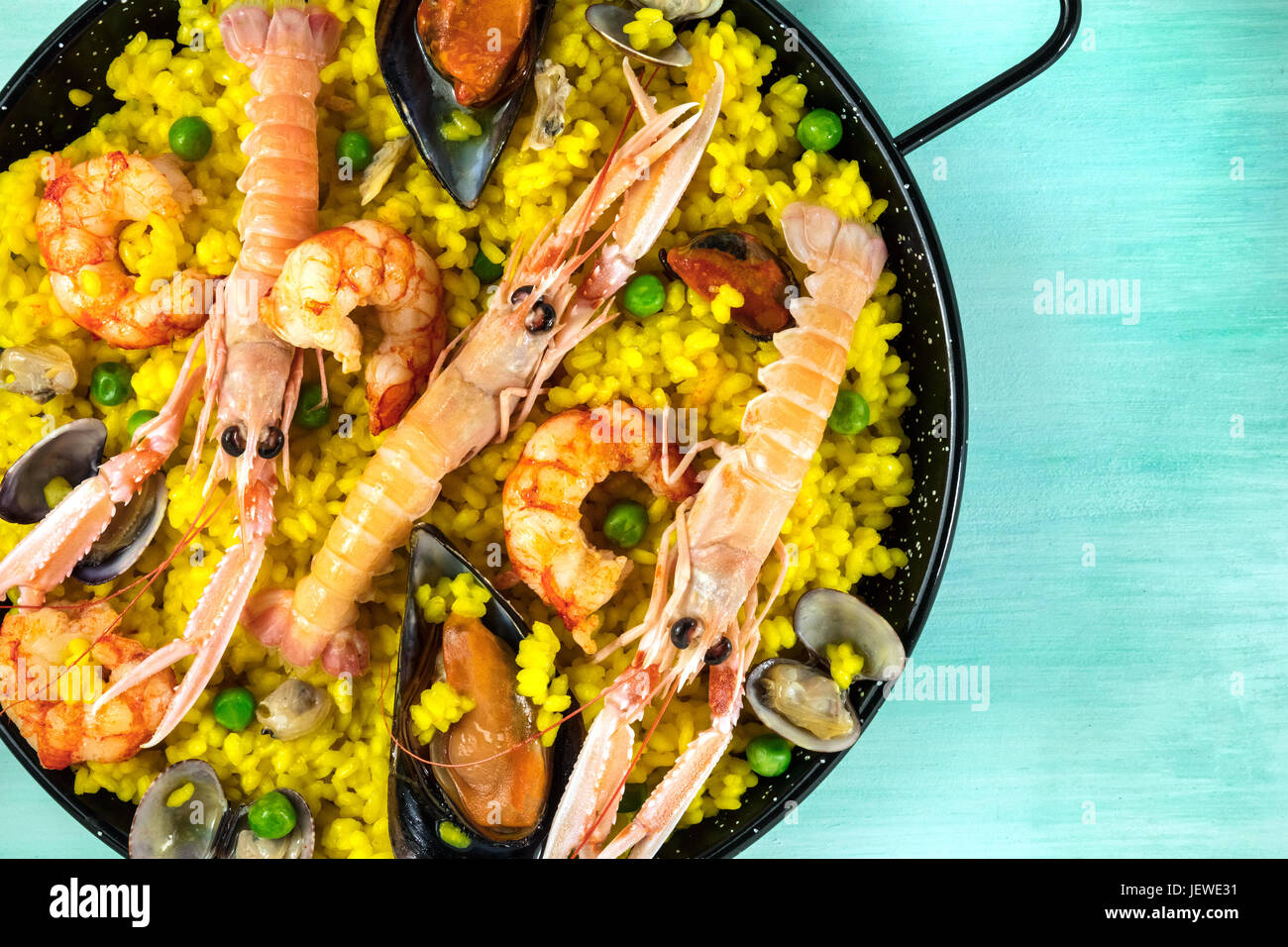 Closeup of Spanish seafood paella in paellera with copyspace Stock ...
