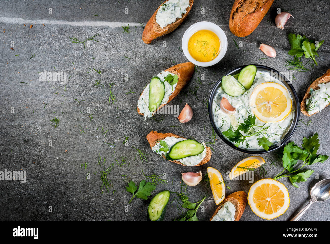 Traditional Caucasian and Greek food. Sauce tzatziki with ingredients ...