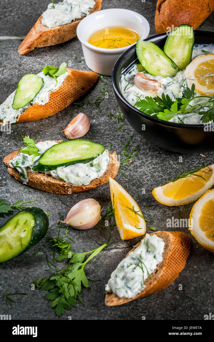 Traditional Caucasian and Greek food. Sauce tzatziki with ingredients ...