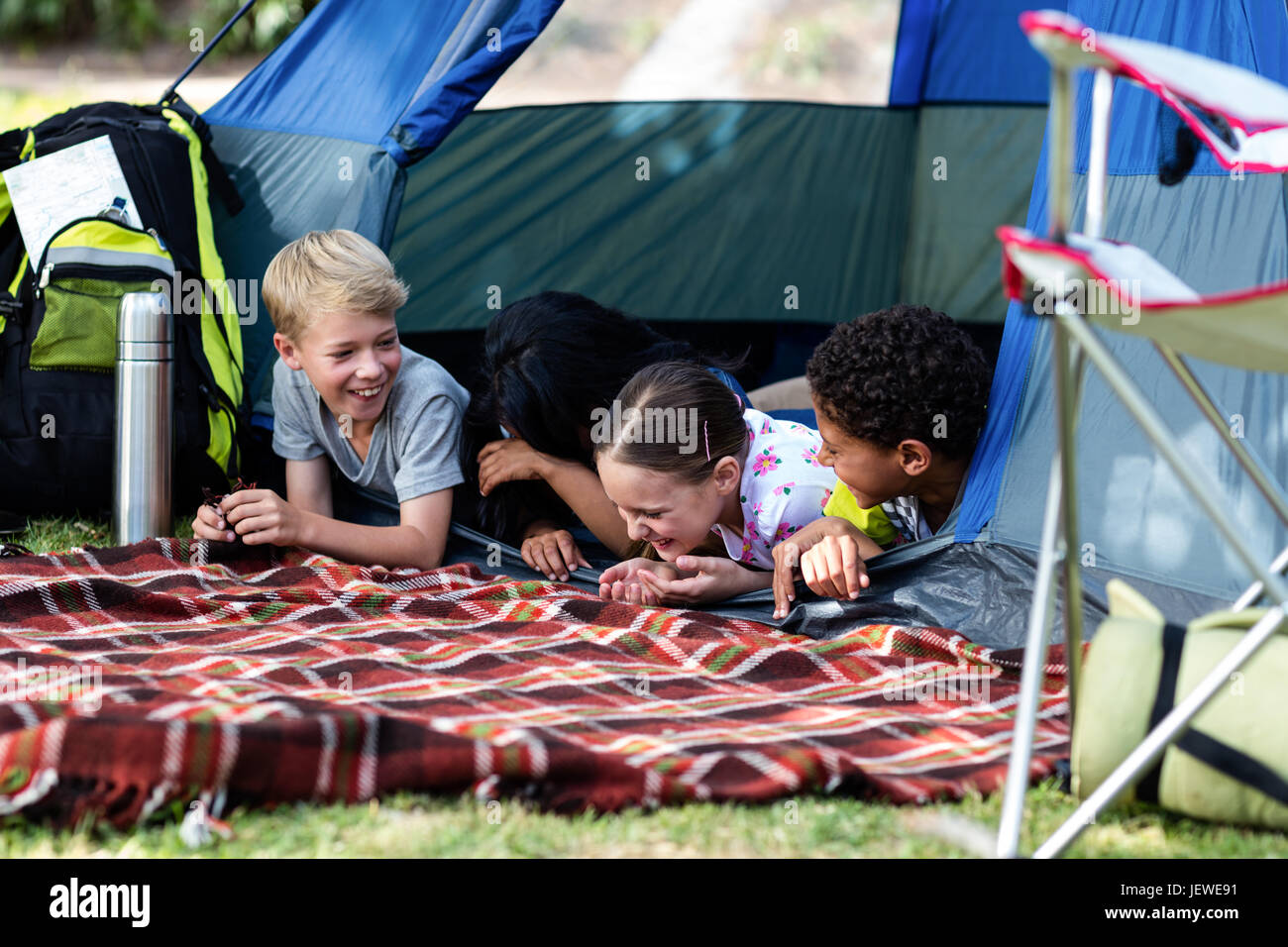 Family having fun in the tent Stock Photo - Alamy