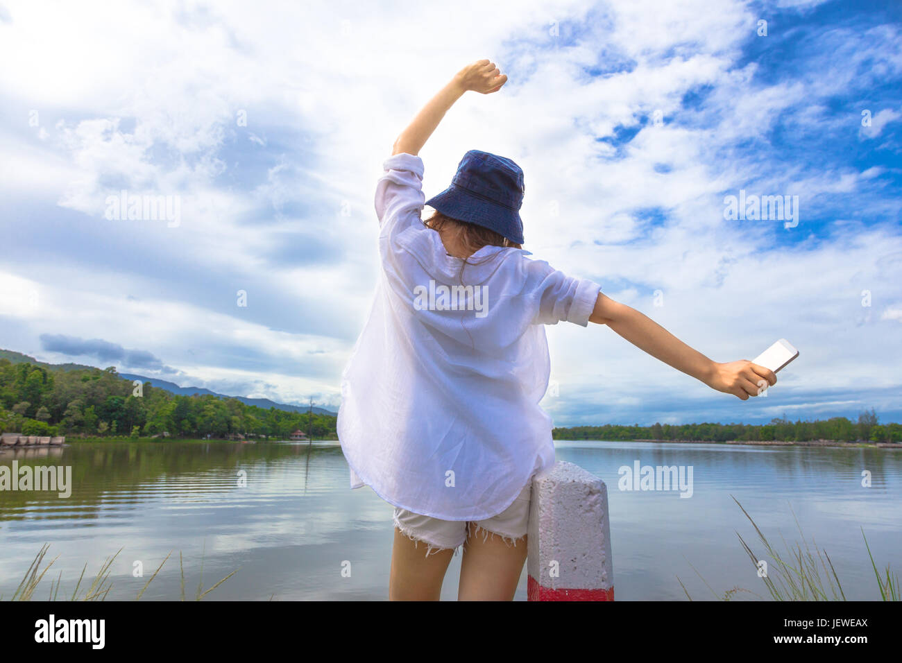 Woman asian phone back view hi-res stock photography and images - Alamy