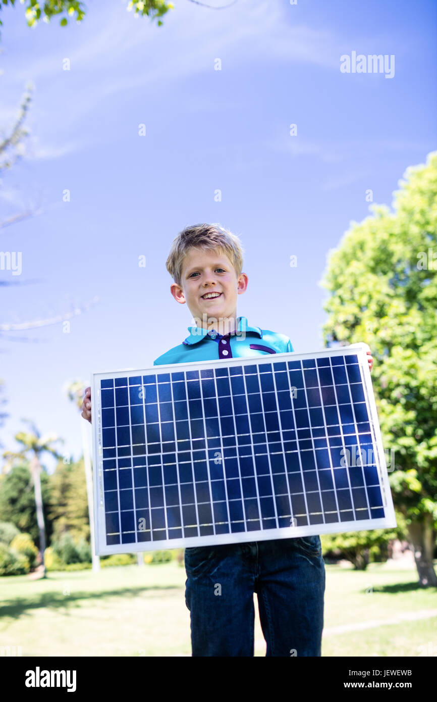 Boy holding a solar panel Stock Photo - Alamy