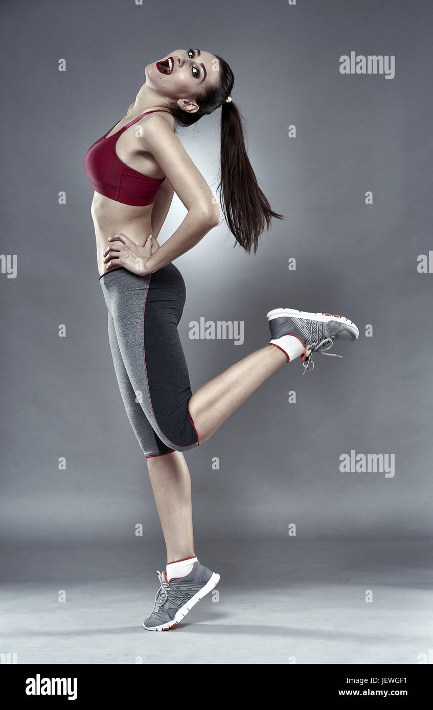 Young female fitness model full length, studio shot Stock Photo - Alamy