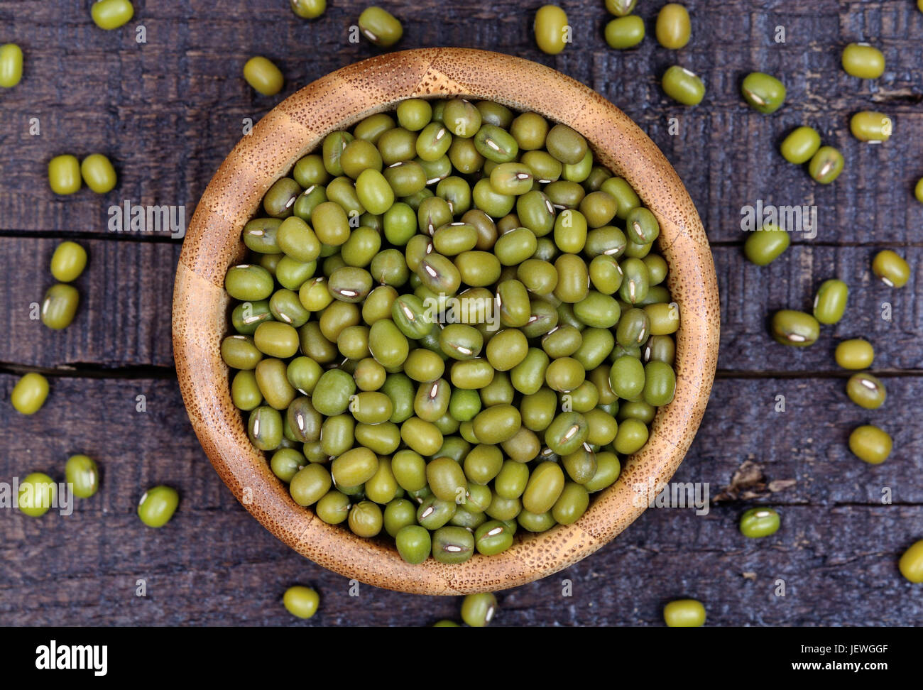 Mung beans in a bamboo bowl on wooden table Stock Photo - Alamy