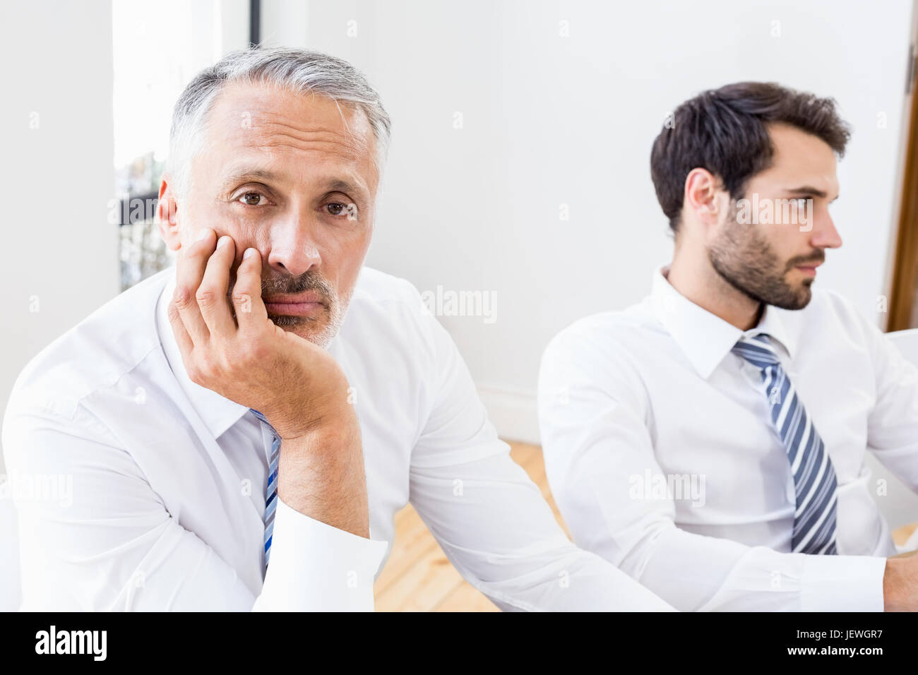 Bored businessman in a meeting Stock Photo - Alamy
