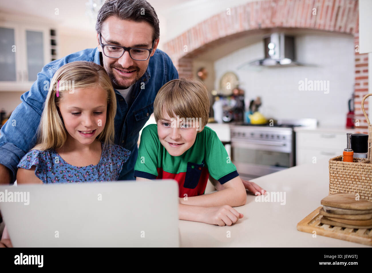 Boy father using notebook hi-res stock photography and images - Alamy