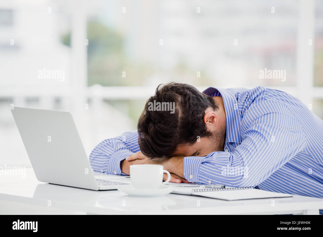 Businessman sitting desk laptop putting hi-res stock photography and ...