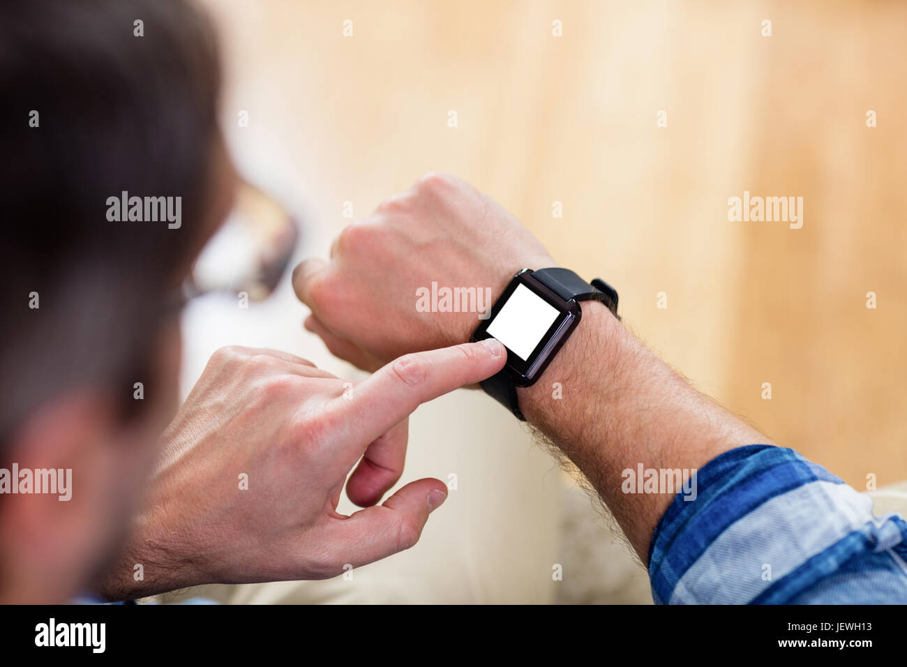A man is touching his watch Stock Photo - Alamy
