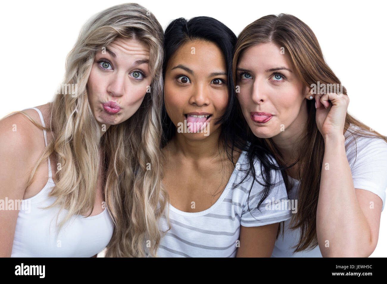 Multiethnic women making funny faces Stock Photo - Alamy