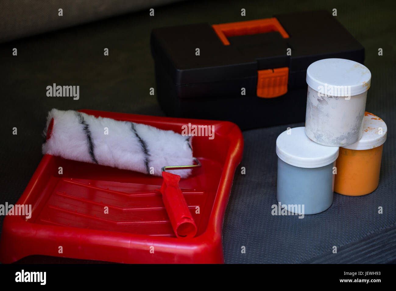 Paint roller, tool box, tray and container Stock Photo - Alamy