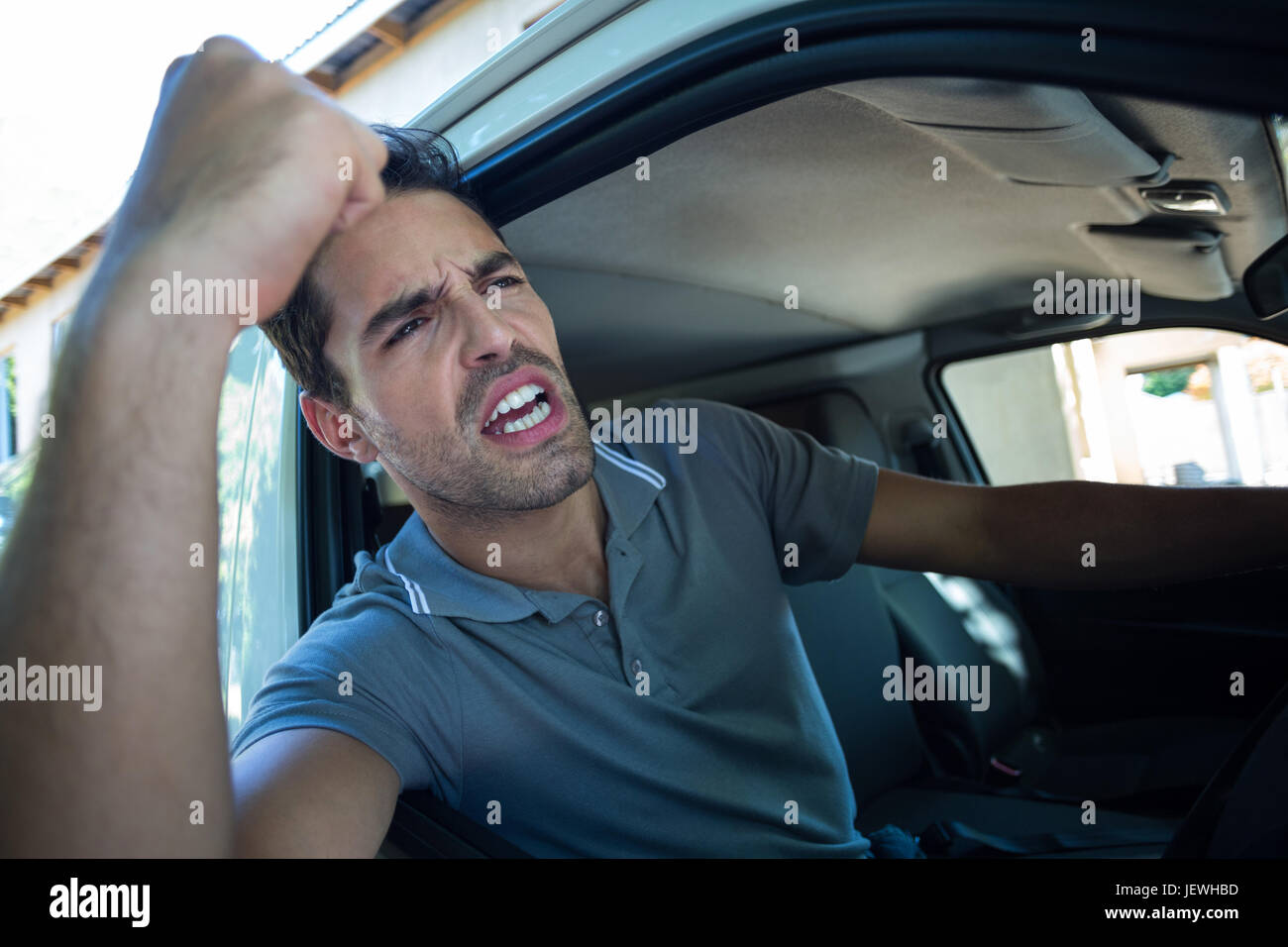 Frustrated driver with fist up Stock Photo - Alamy