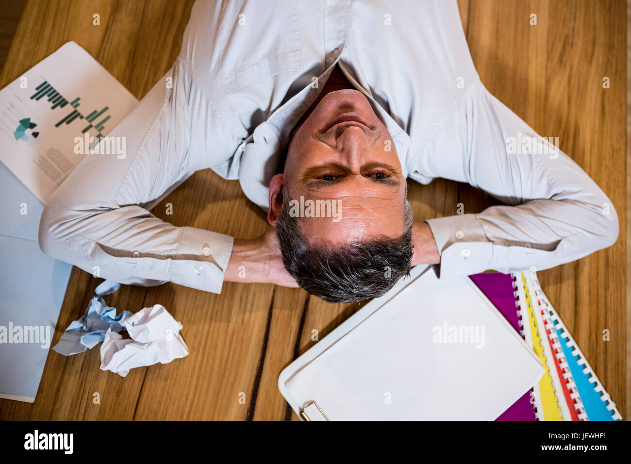 Serious professional man lying hi-res stock photography and images - Alamy