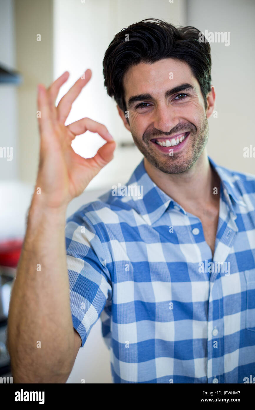 Portrait of man showing hand ok sign Stock Photo - Alamy