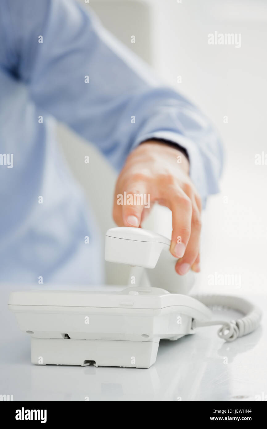 Mid-section of mans hand receiving a phone Stock Photo - Alamy