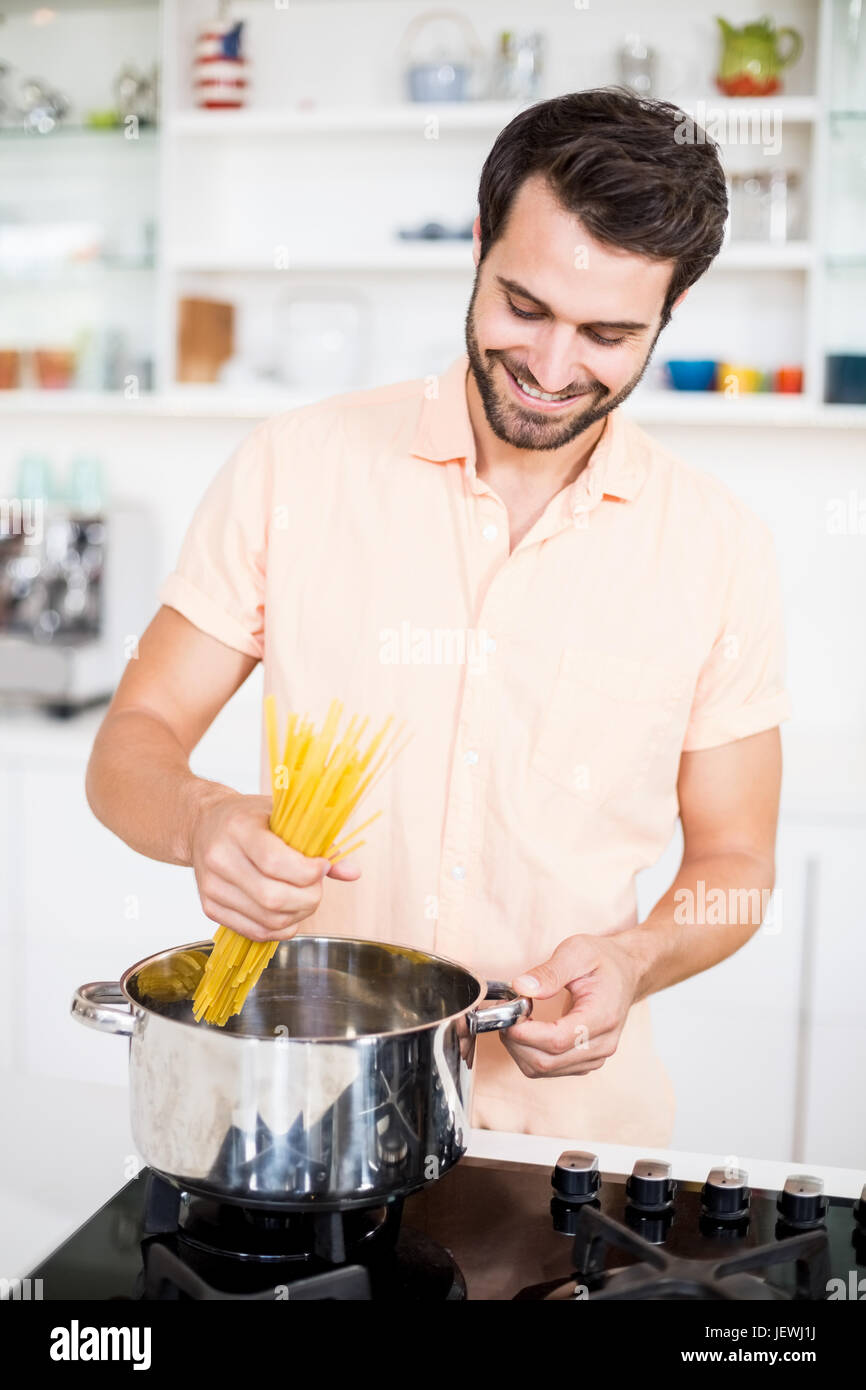 Man cooking spaghetti Stock Photo - Alamy