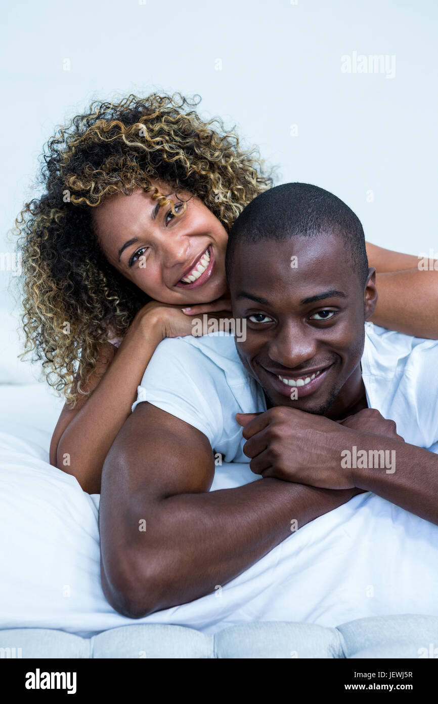 Young mixed race couple cuddling hi-res stock photography and images ...