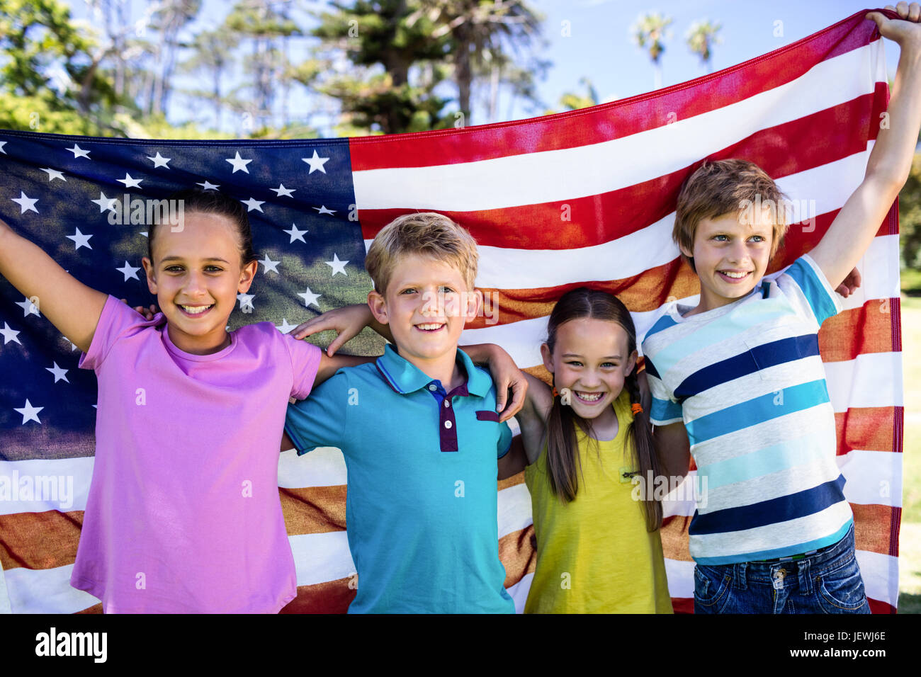 Children holding american flag in hi-res stock photography and images ...