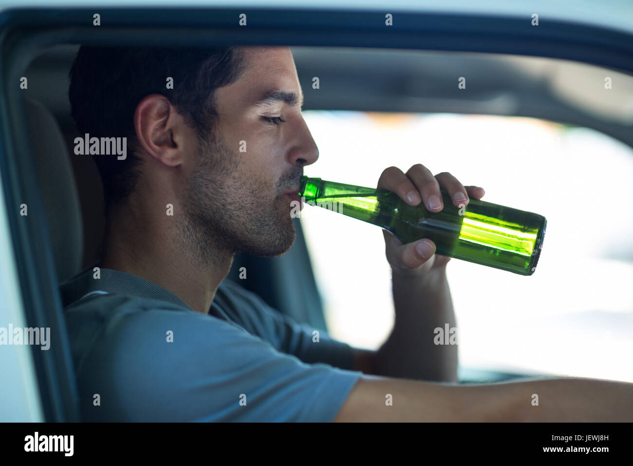 Close-up of man drinking alcohol Stock Photo - Alamy