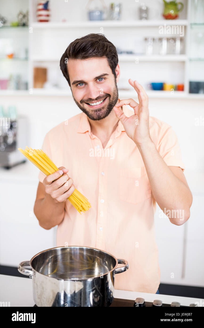 Man cooking spaghetti Stock Photo - Alamy